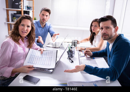 Group Of Business Executives Complaining Toward Camera In Office Stock ...