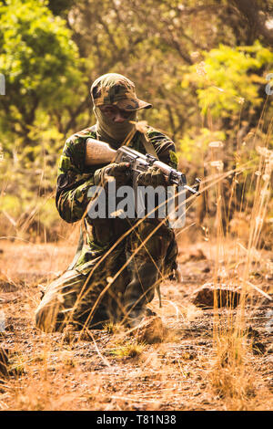 Rangers from Africa, in action, on patrol, in the grassland Stock Photo ...