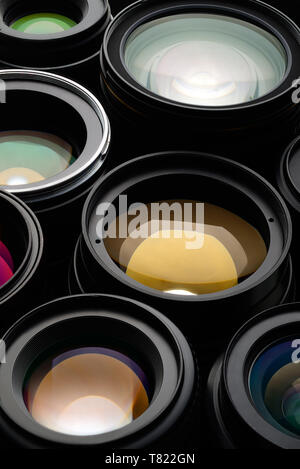 Many camera lens different sizes and colors Stock Photo - Alamy