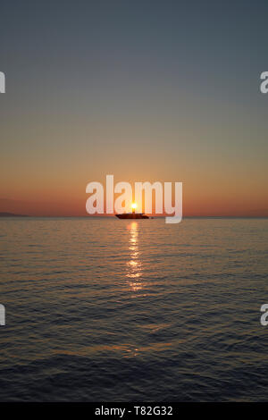 Amazing image of an ankered yacht in the middle of the sun during ...