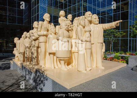 Illuminated Crowd Sculpture by Raymond Masson in front of a Stock Photo ...