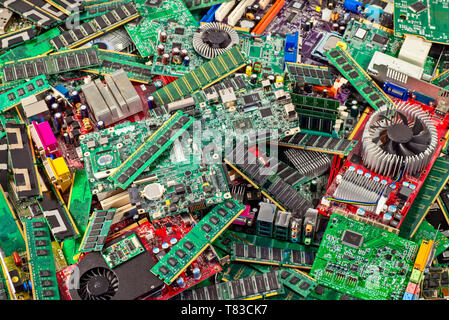 Pile of electronic waste, computer motherboard, wires, battery, some ...