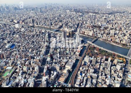Aerial view of Sumida City and Taito City wards along the Sumida River ...