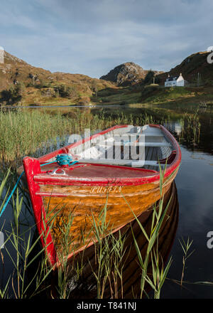 Boat house on the edge of a loch in Scottish autumn landscape. Loch ...
