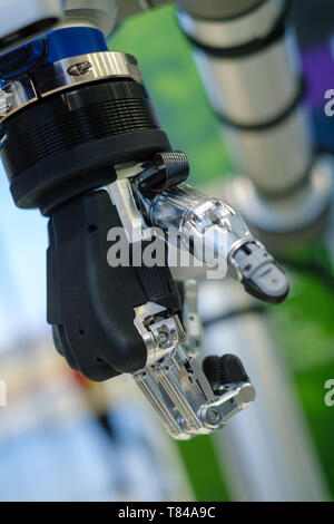 Close-up of an industrial robotic arm component with metal parts and ...