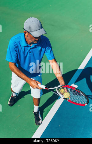 young man play tennis outdoor Stock Photo - Alamy