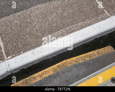 Gap between railway platform edge and railway carriage step painted ...