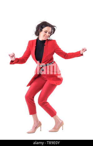 attractive businesswoman jumping in dance while listening music in ...