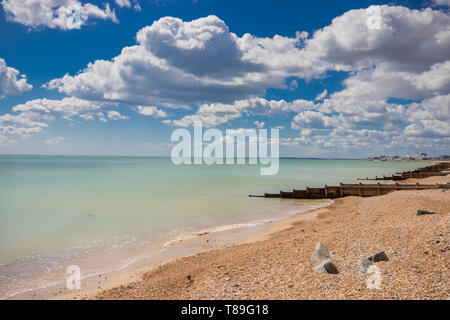 Seaside scene looking towards Butlins holiday resort on a sunny day in ...