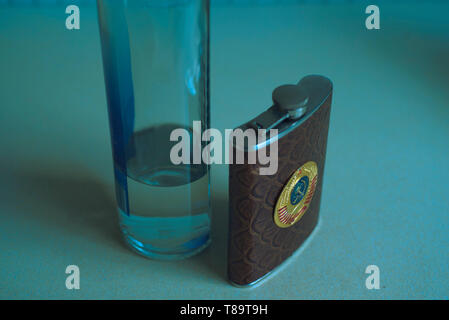 Bottle of vodka and a flask with USSR coat of arms Stock Photo - Alamy