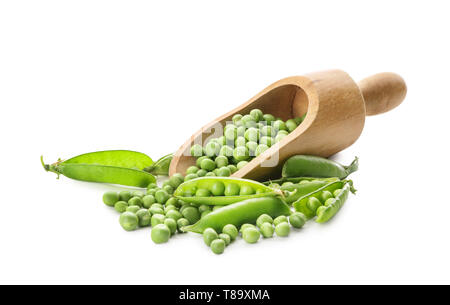 Scoop with green peas on white background Stock Photo - Alamy