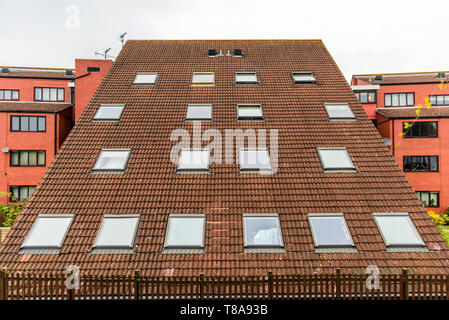 45 degree angle wall of red brick apartments building in england uk ...