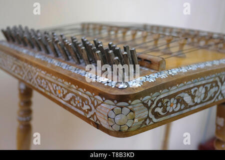 Chang ornately stringed instrument made of wood and mother of pearl ...