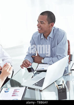 money Manager sitting at Desk in the office Stock Photo - Alamy