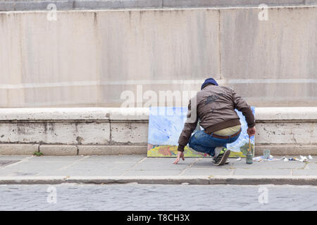 Rome, Italy. 11th May, 2019. A street painter paints en plein air near ...