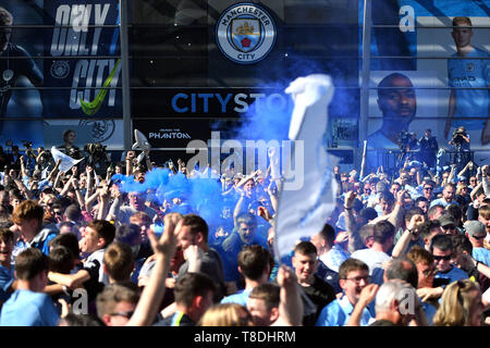 Manchester City fans celebrate their team's fourth goal of the game at ...