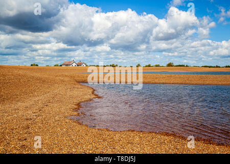 Shingle beach lagoon coastline at East Lane, Bawdsey, Suffolk, England ...