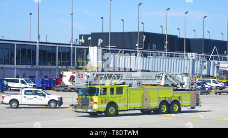 CHICAGO, IL -21 APR 2019- View of a yellow firetruck near an American ...