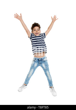 Cute little boy jumping on white background Stock Photo - Alamy