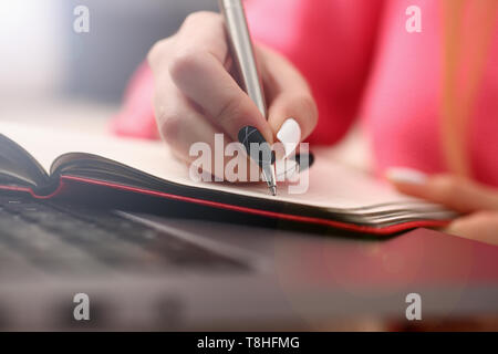 woman study hard write down information to notebook Stock Photo - Alamy