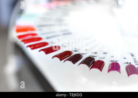 Table full of manicure utensils, manicure tools, nail polish colours on ...