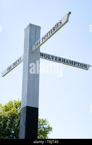 Wooden direction signpost to the Potteries, Wolverhampton and the Trent ...