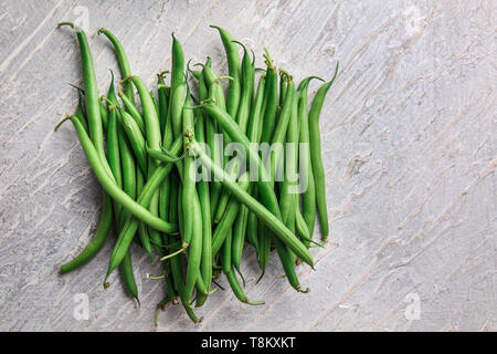 Fresh green beans on light background Stock Photo - Alamy