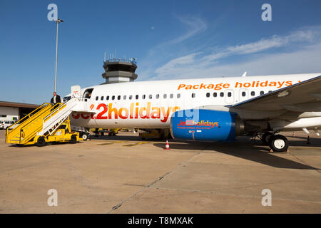 Jet2 package holiday plane passengers disembarking at the airport Faro ...