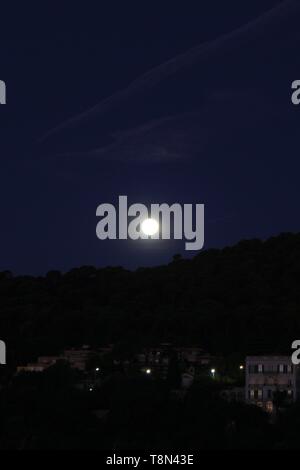 The moon setting at dawn over the French Riviera Stock Photo - Alamy