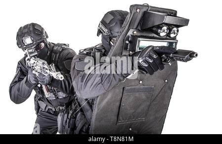 SWAT team behind ballistic shield studio shoot Stock Photo - Alamy