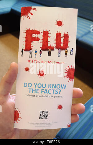 A leaflet with advice for patients about Flu is seen in an NHS local ...