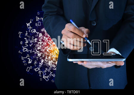 Man showing the binary digits with tablet computer Stock Photo - Alamy