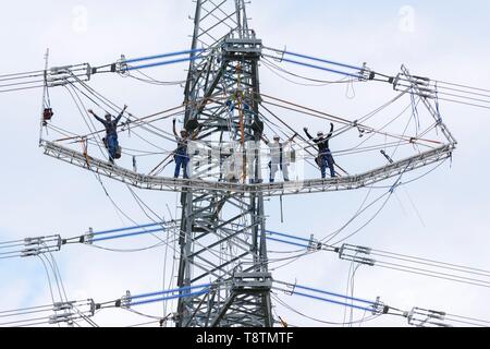 High-voltage engineers, overhead power lines, Germany Stock Photo - Alamy