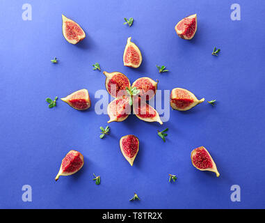 Composition with fresh figs on color background Stock Photo - Alamy