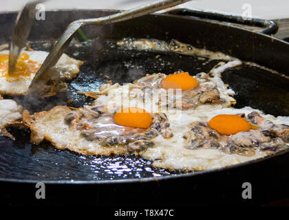 Fried crispy mussels in batter with lemon, sauce and salad Stock Photo ...
