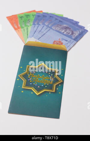 'Duit Raya' is money given from adult to children during Eid al-Fitr ...