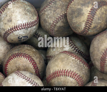 Bucket of practice baseballs at a high school game Stock Photo - Alamy