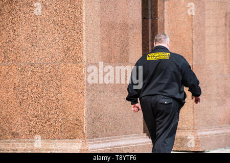 Security guard protection. Fat, heavily plump guard bypasses territory ...