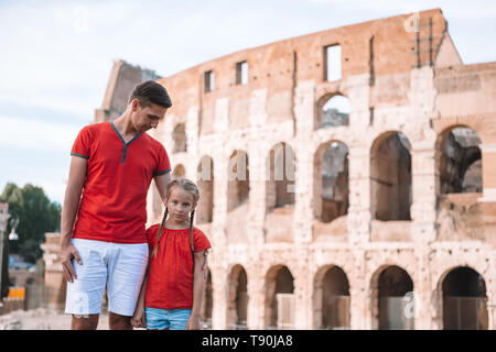 Happy family in Rome over Coliseum background Stock Photo - Alamy
