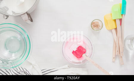 Step by step. Flat lay. Mixing royal icing in electric kitchen mixer ...