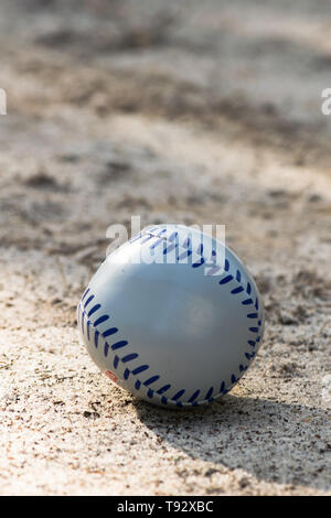 Phillies Soft Baseball in the Sand Stock Photo - Alamy