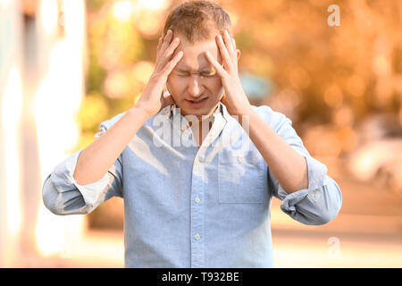 Man having panic attack outdoors Stock Photo - Alamy