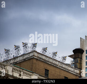 Roof of a building with metal railing, chimney and antenna and surfaces ...