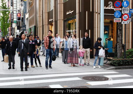 People waiting in line with shopping baskets at grocery store Stock ...