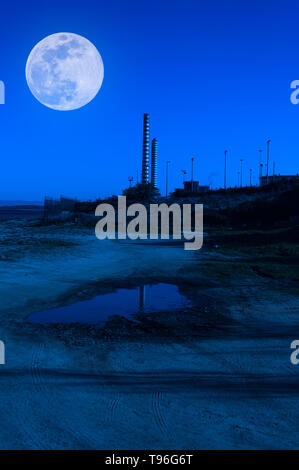 Industrial chimney and moon with blue sky background Stock Photo - Alamy