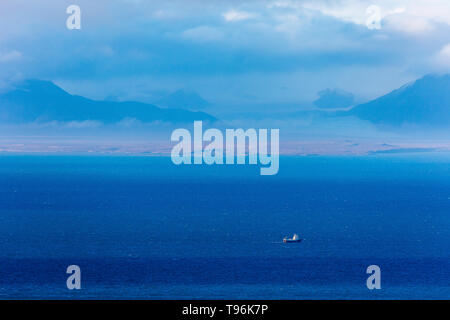View across Isfjord in Svalbard, Blue water with boat and glaciers in ...