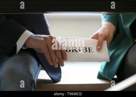 Businessman taking bribe from woman. Corruption concept Stock Photo - Alamy