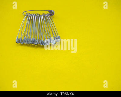 Lots of safety pins. Team concept Stock Photo - Alamy