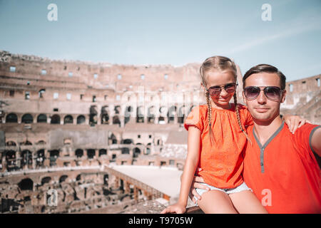 Happy family in Rome over Colosseum background Stock Photo - Alamy