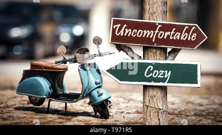 Street Sign the Direction Way to Cozy versus Uncomfortable Stock Photo ...